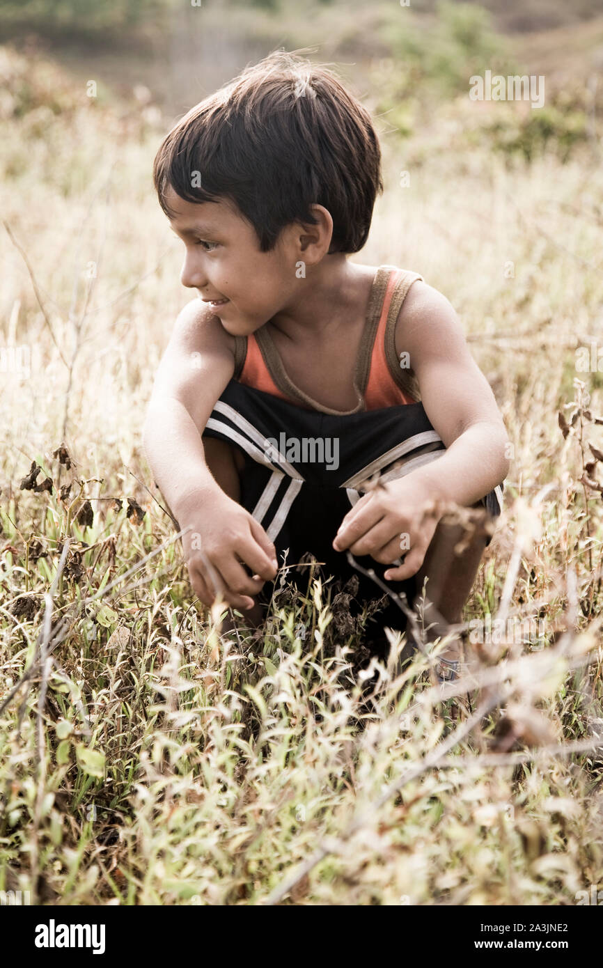 Farmer children playing in the field in Mexico Stock Photo - Alamy