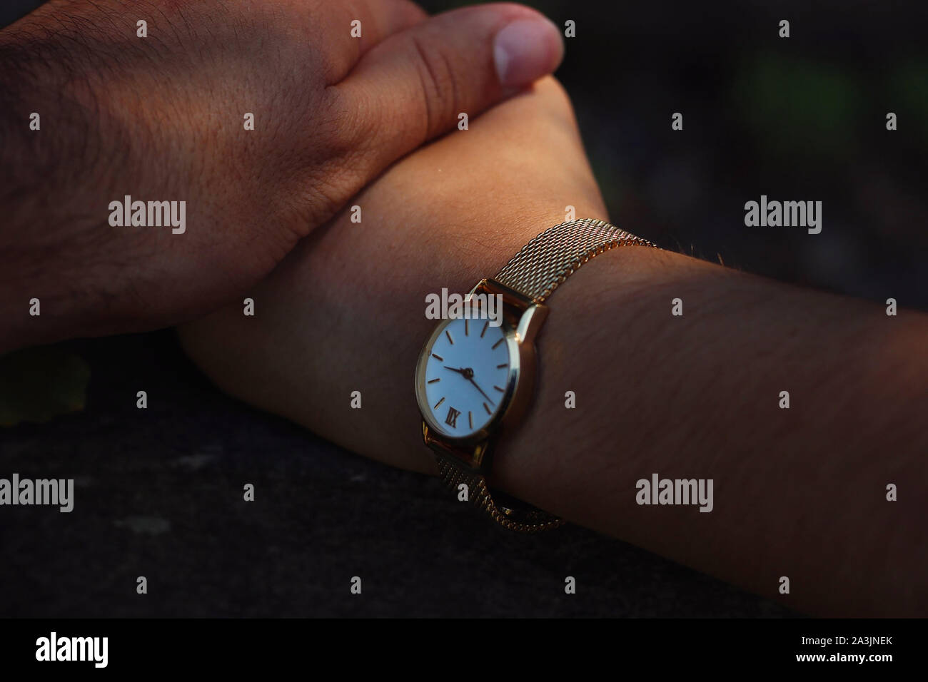 Young girl with a gold watch and quartz on her wrist. Pure gold jewelry ...