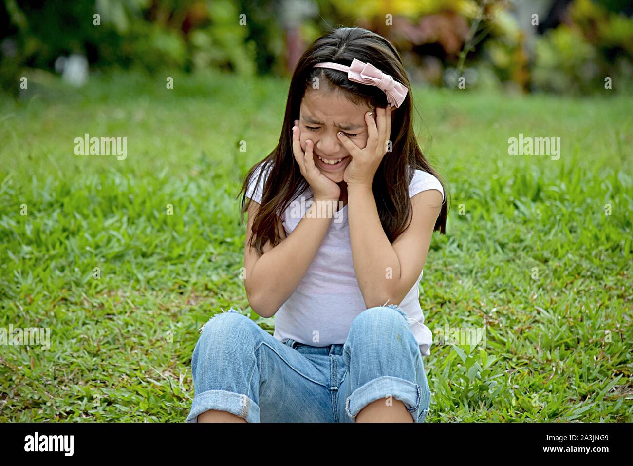 A Crying Petite Juvenile Stock Photo - Alamy