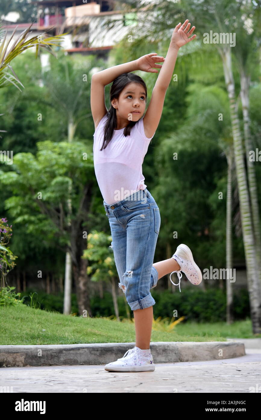 A Posing Filipina Girl Standing Stock Photo - Alamy