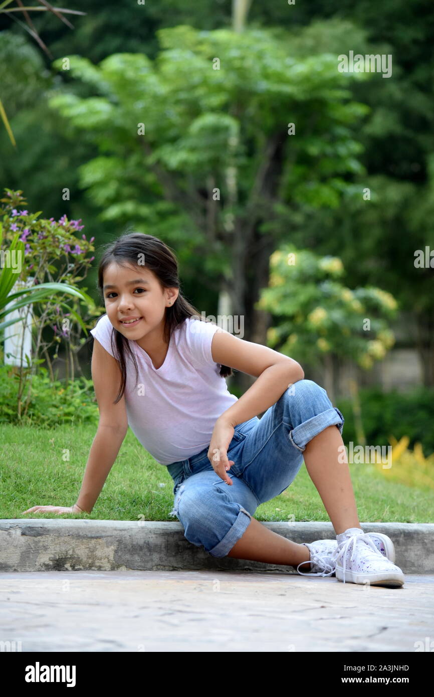 Girl sitting kids hi-res stock photography and images - Alamy