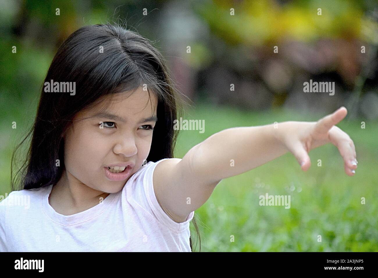 A Young Tween Pointing Stock Photo - Alamy