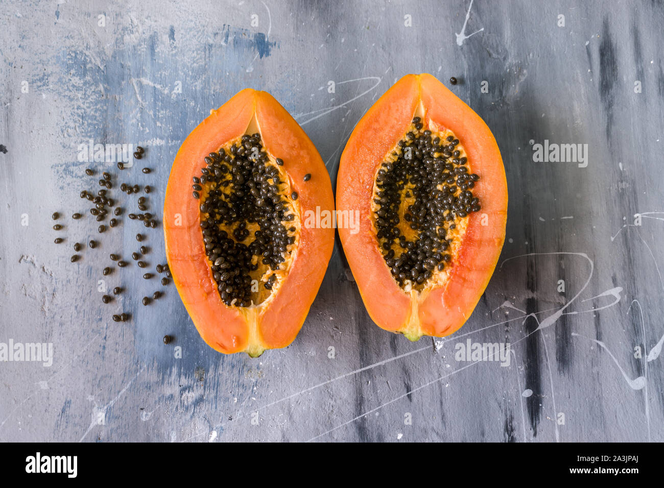 papaya on lead background Stock Photo - Alamy