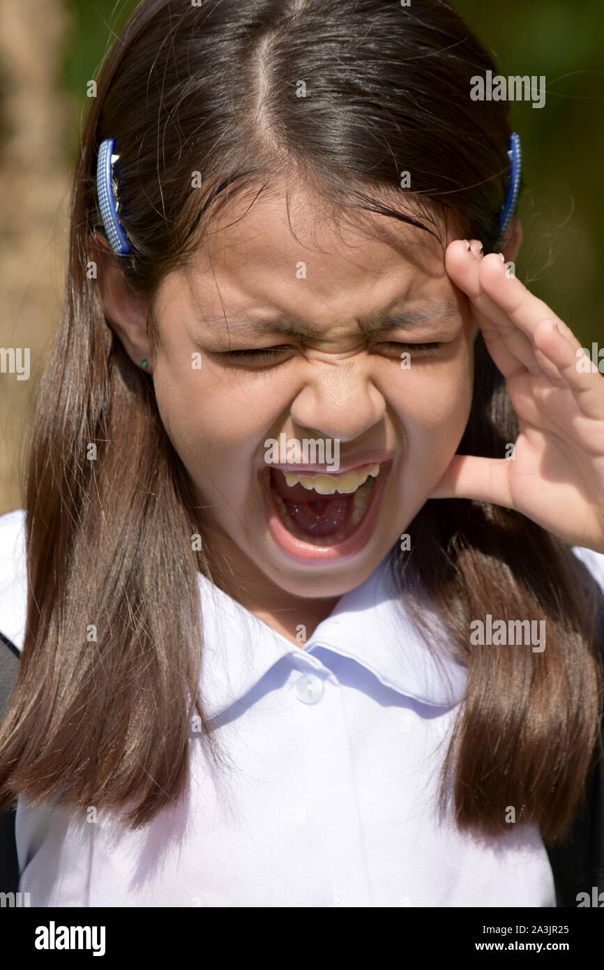 Filipina Female Student Under Stress With Books Stock Photo - Alamy