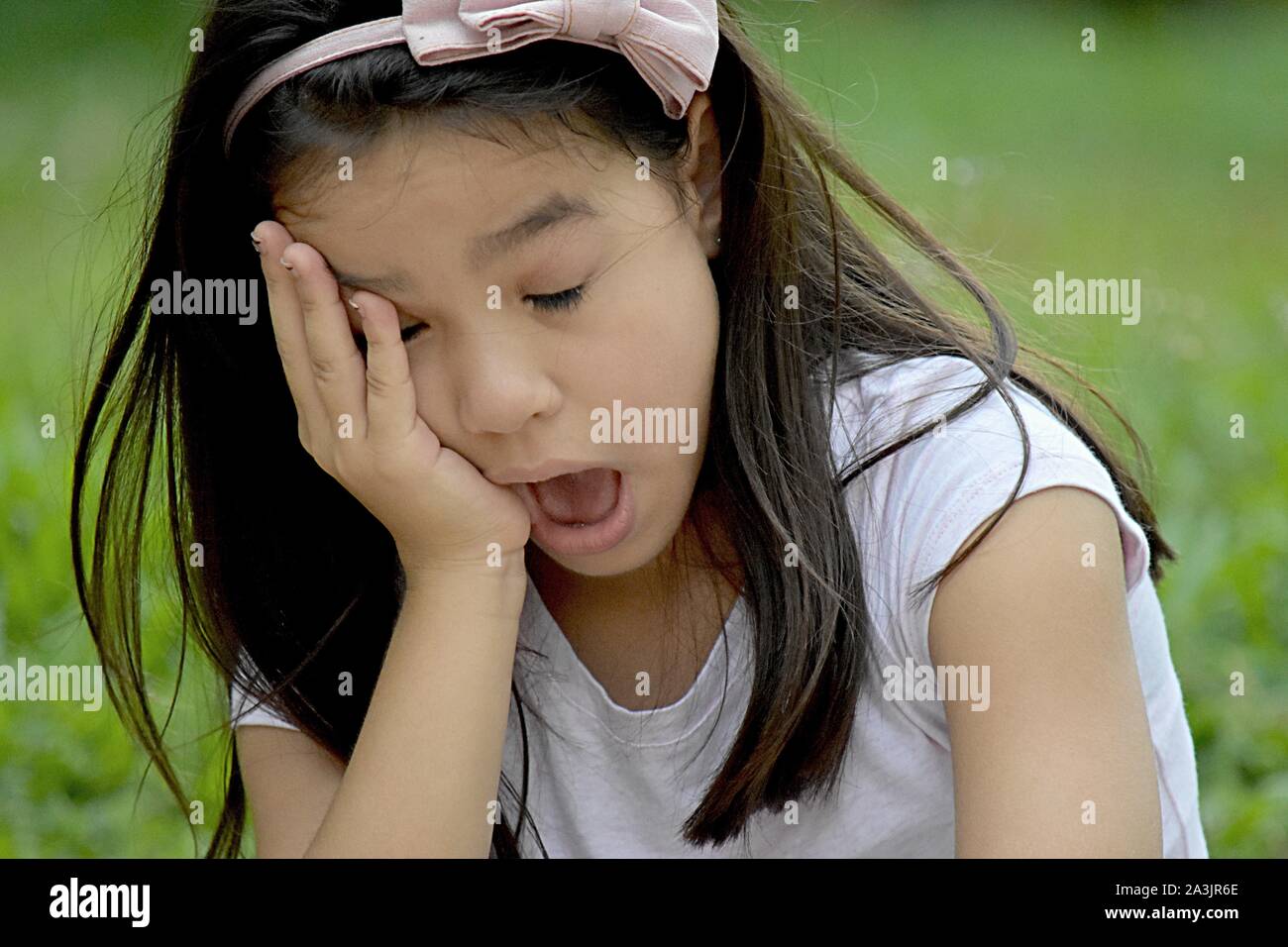 A Girl Child Yawning Stock Photo - Alamy