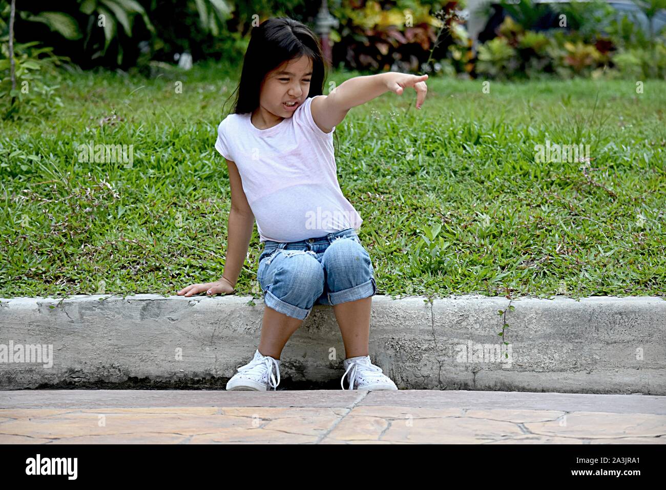 A Pointing Beautiful Minority Female Stock Photo - Alamy
