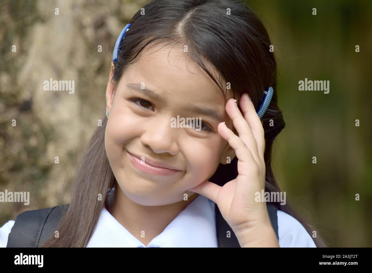 Student Child Wondering Wearing Uniform With Books Stock Photo - Alamy