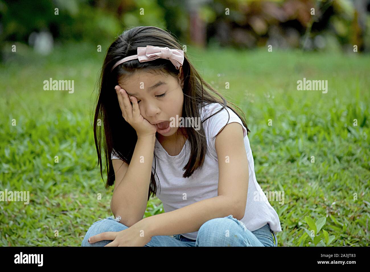 A Diverse Female Yawning Stock Photo - Alamy