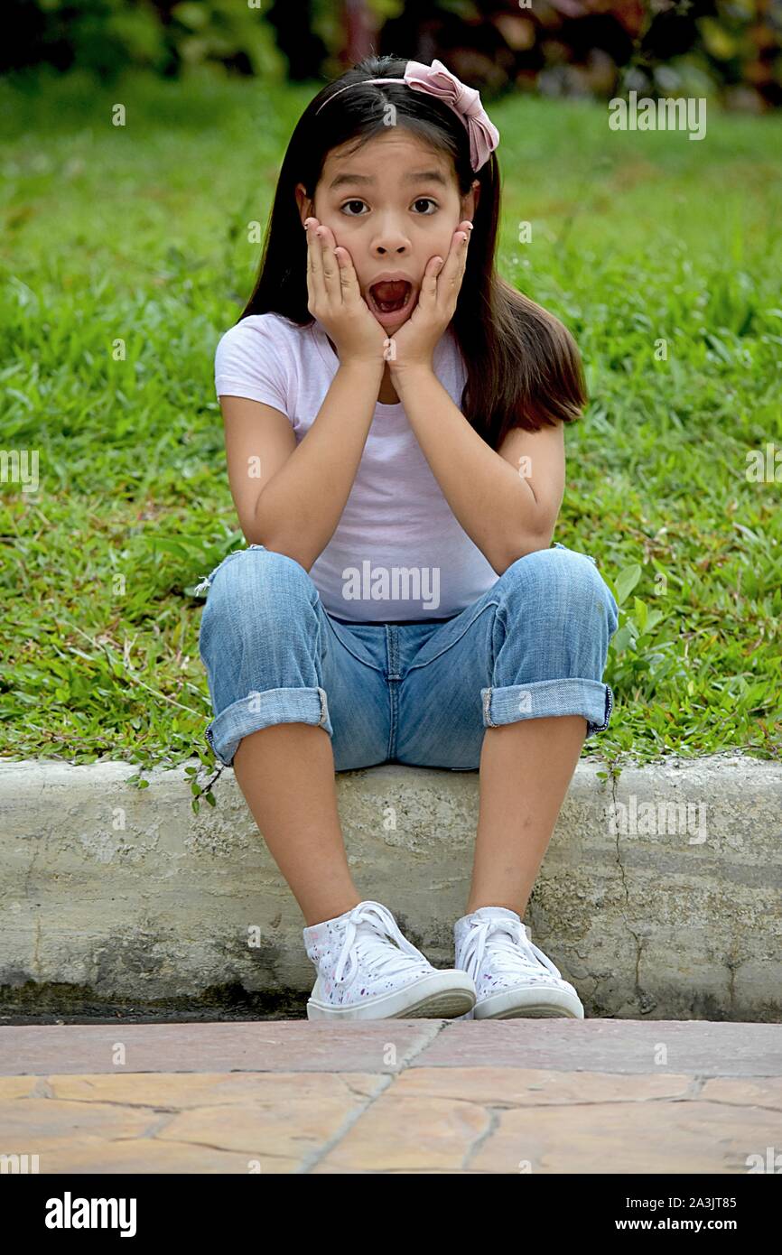 A Surprised Cute Diverse Girl Child Stock Photo - Alamy