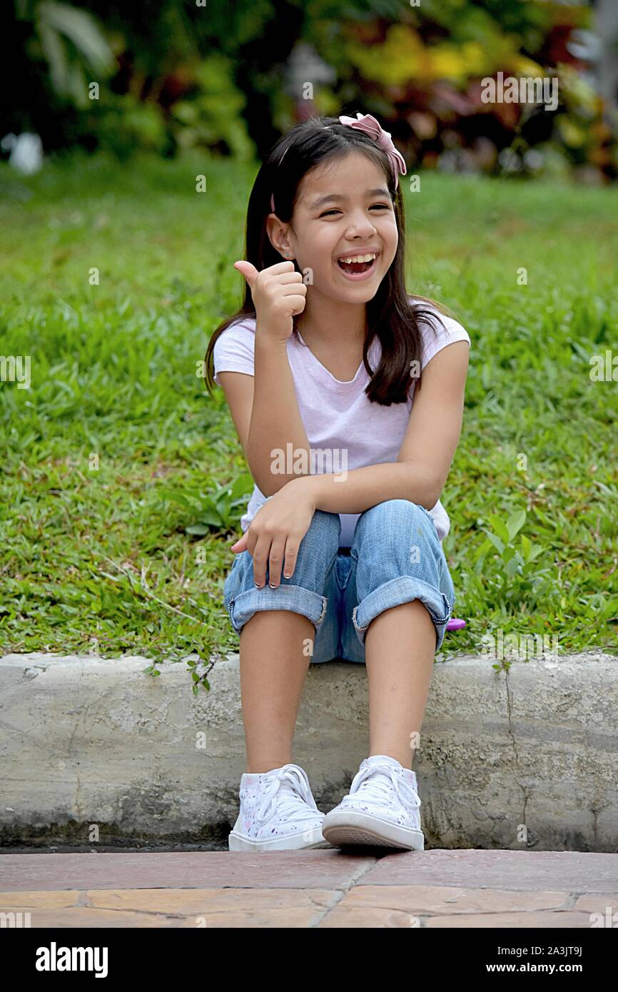 A Tween With Thumbs Up Stock Photo - Alamy