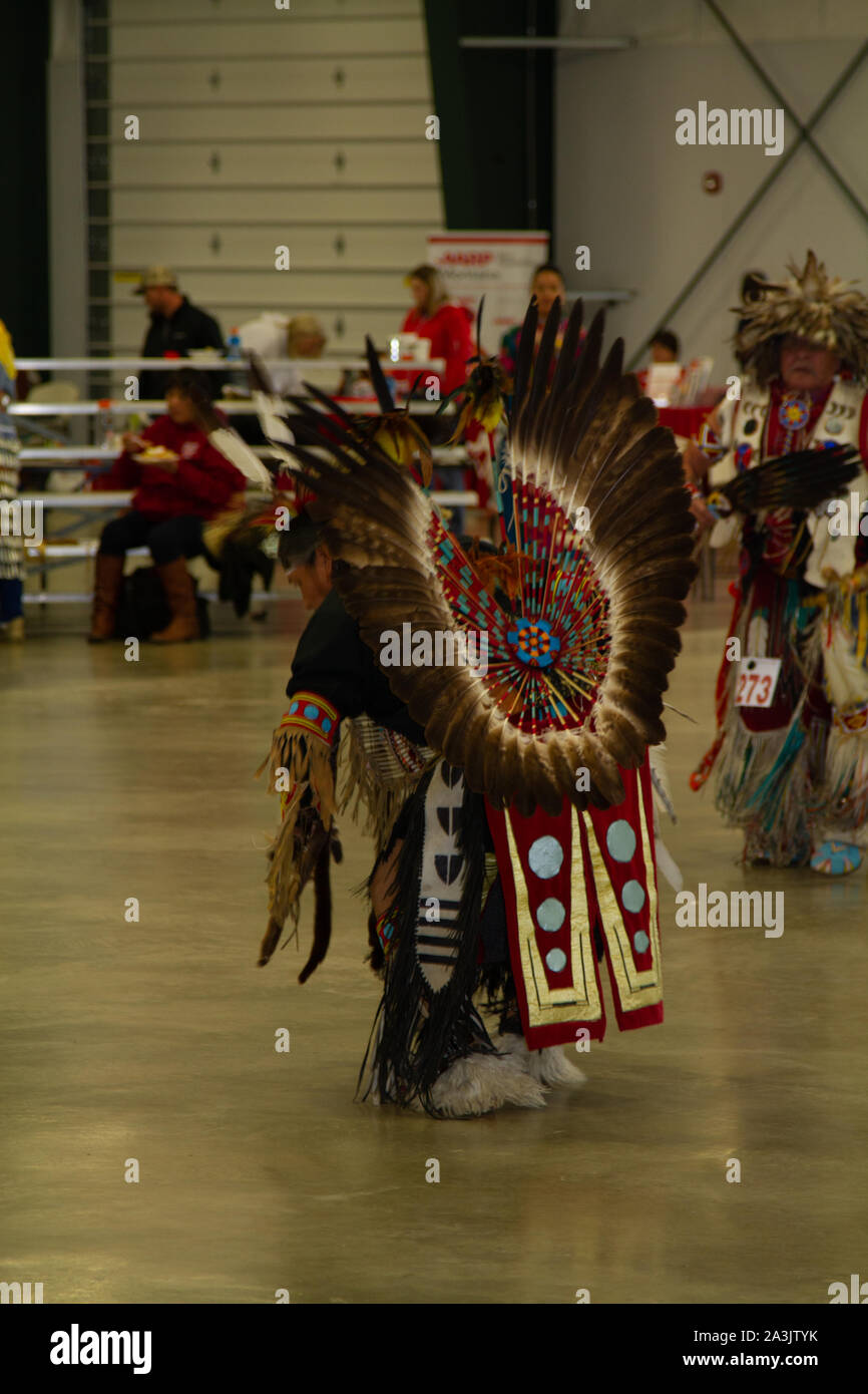 Native American dancer dancing in full regalia at a Pow Wow where ...