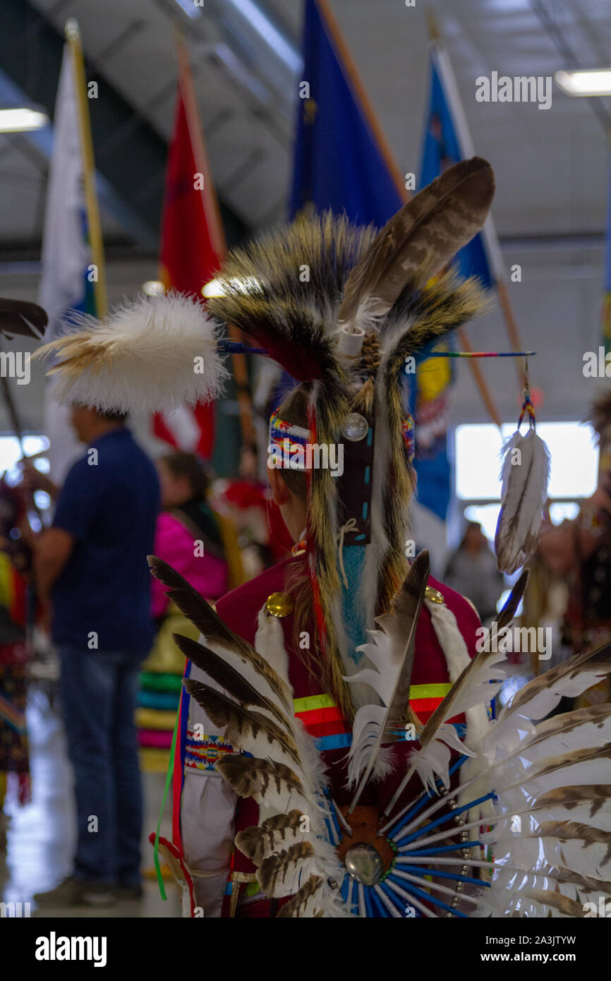 Young indigenous dancer dressed in full regalia at a Pow Wow where ...