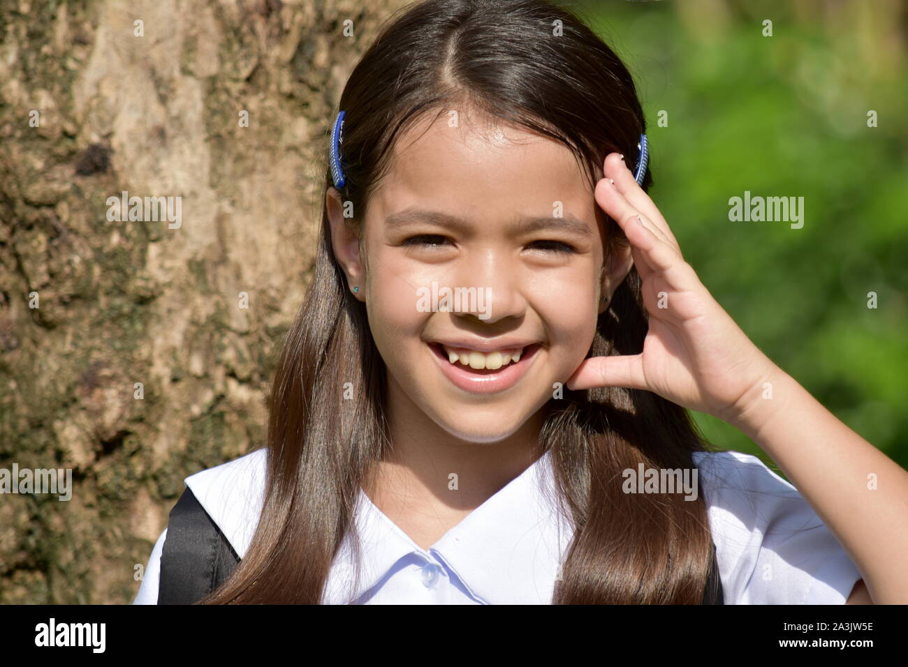A School Girl Thinking With Notebooks Stock Photo - Alamy