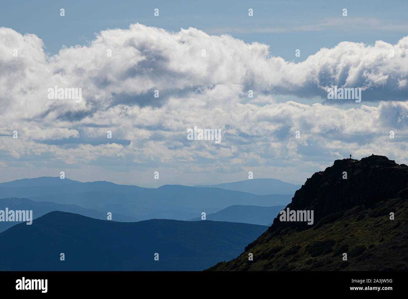 Lone hiker on the summit of Mount Monroe in the White Mountains of NH ...
