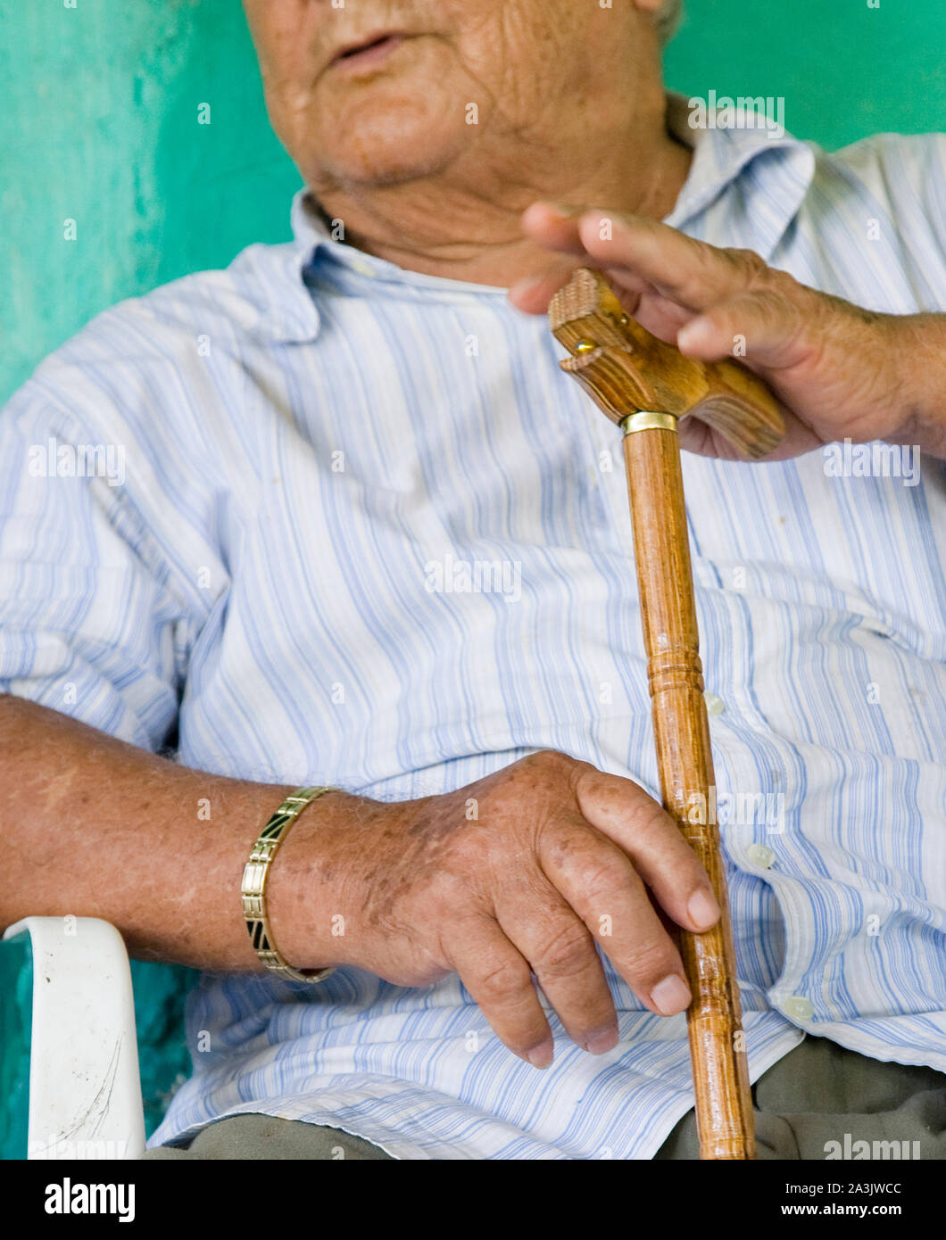 Portraits of a farm worker at his home in Oaxaca, Mexico. Holding his ...