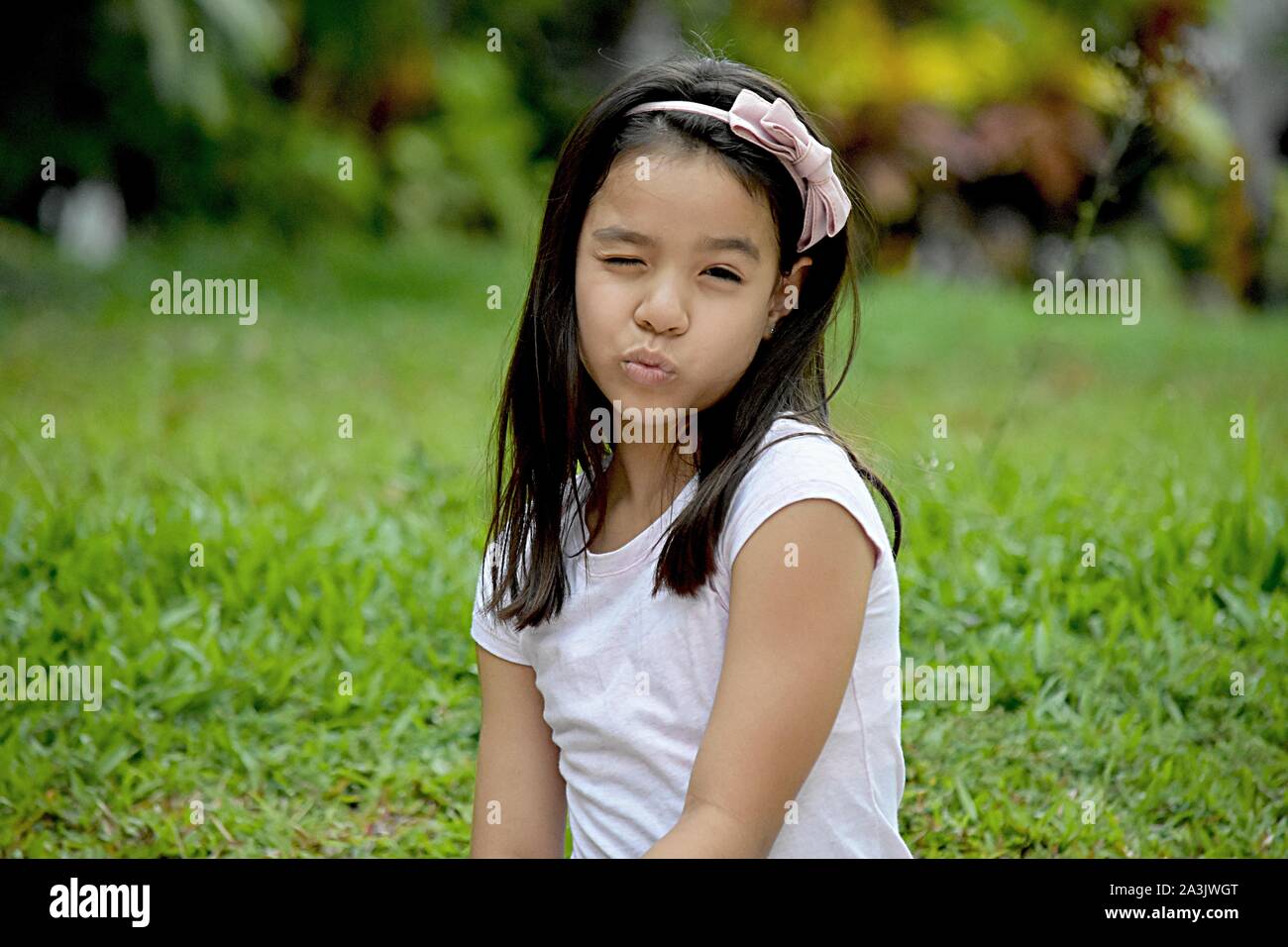 A Pretty Diverse Female Winking Stock Photo - Alamy