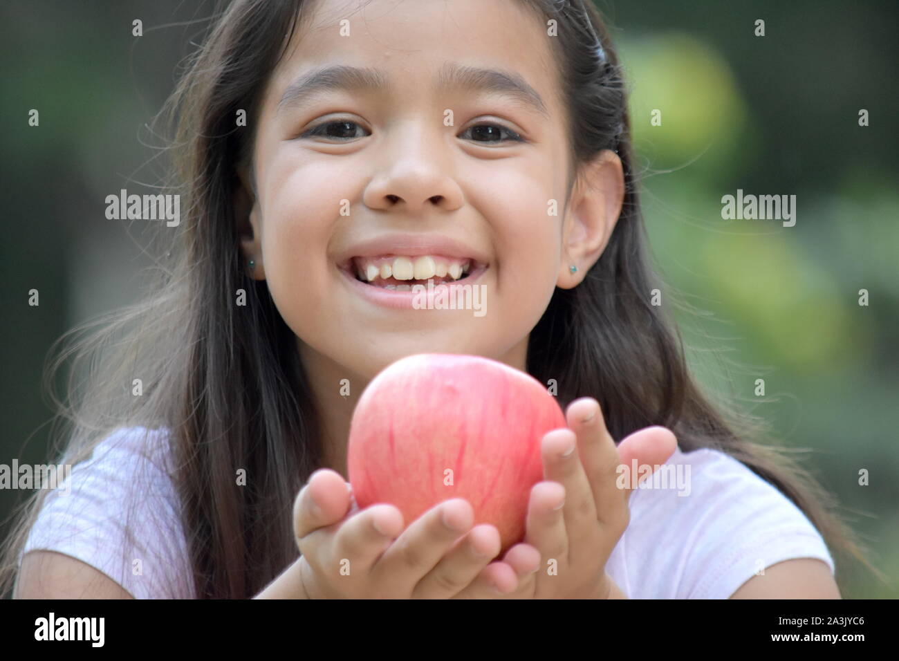 A Pretty Female Smiling With Food Stock Photo - Alamy