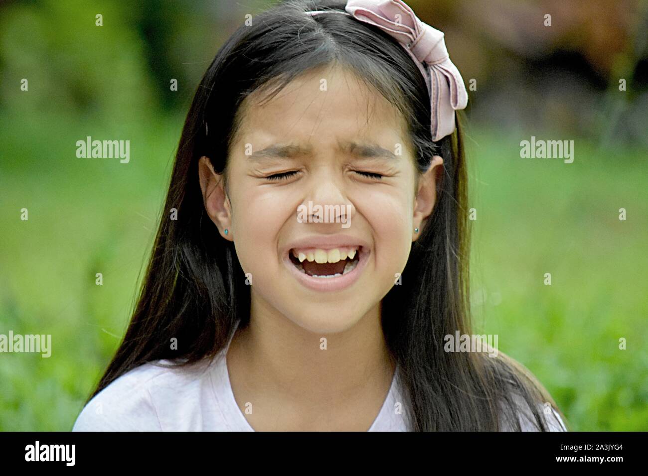 An Anxious Cute Filipina Girl Preteen Stock Photo - Alamy