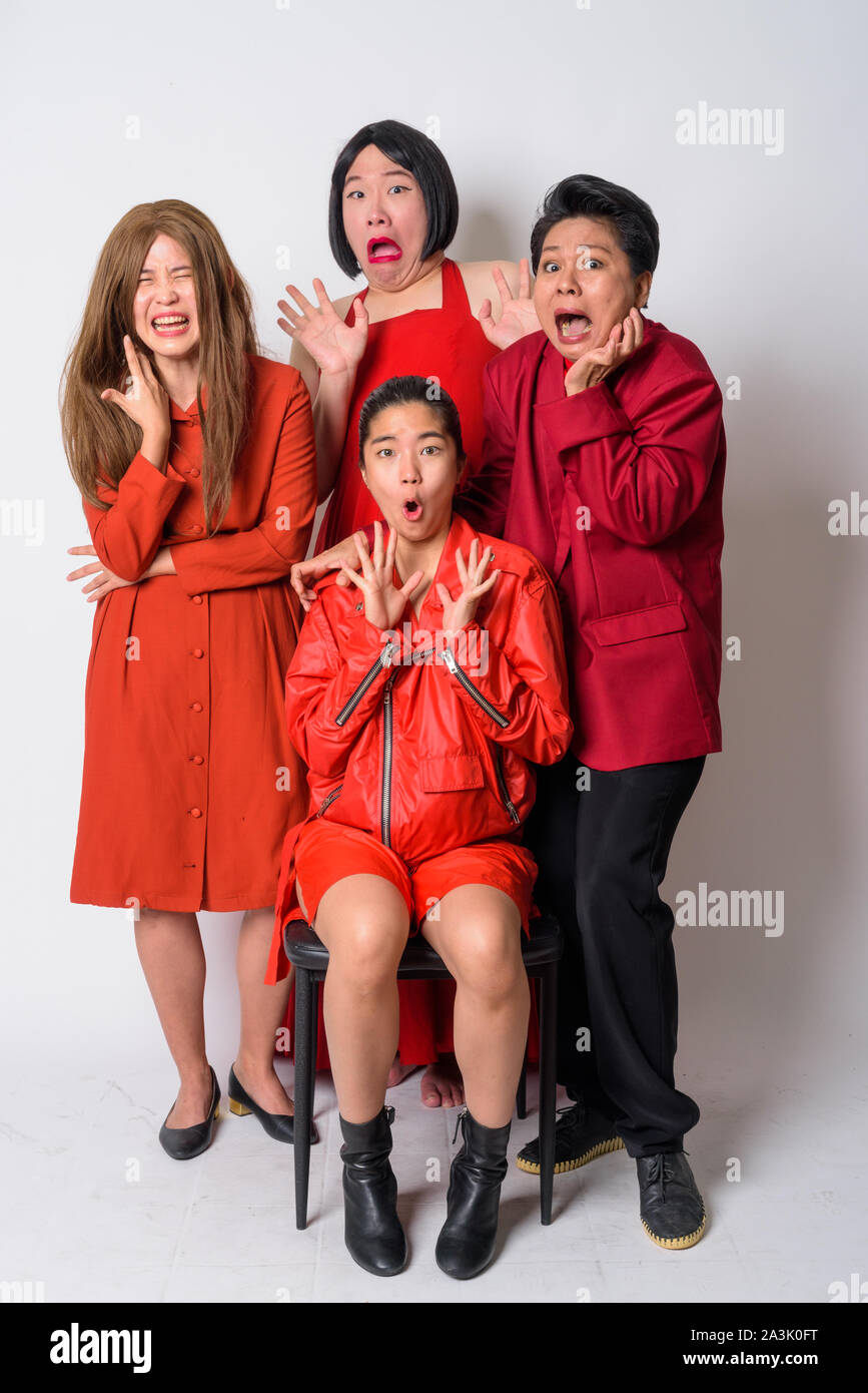 Group of diverse Asian friends looking shocked and scared together ...