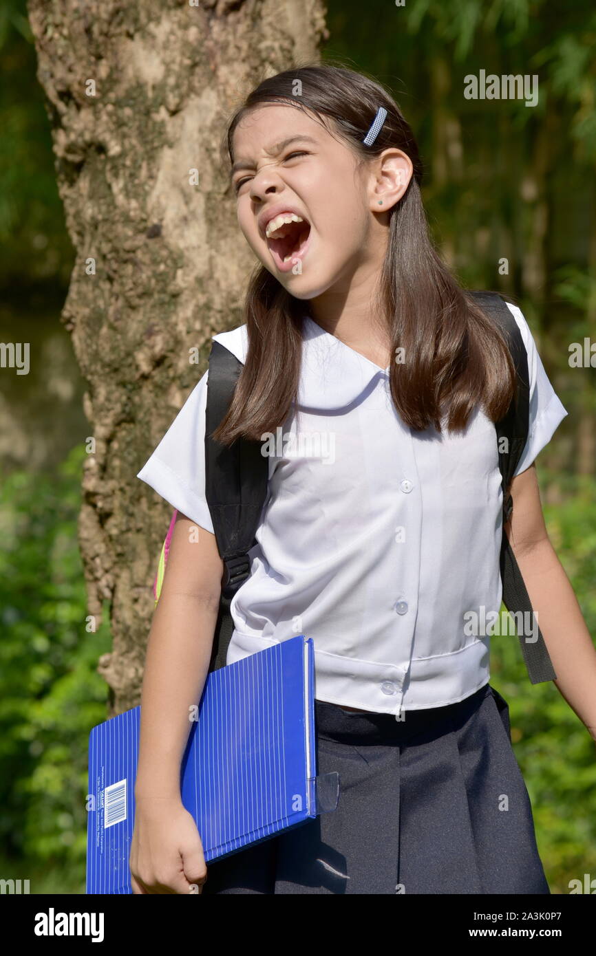 Young Student Child And Anger Wearing Uniform Stock Photo - Alamy
