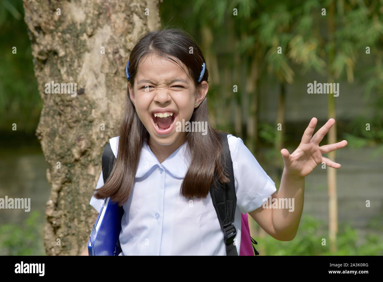 An Angry Diverse Child Girl Student Stock Photo - Alamy