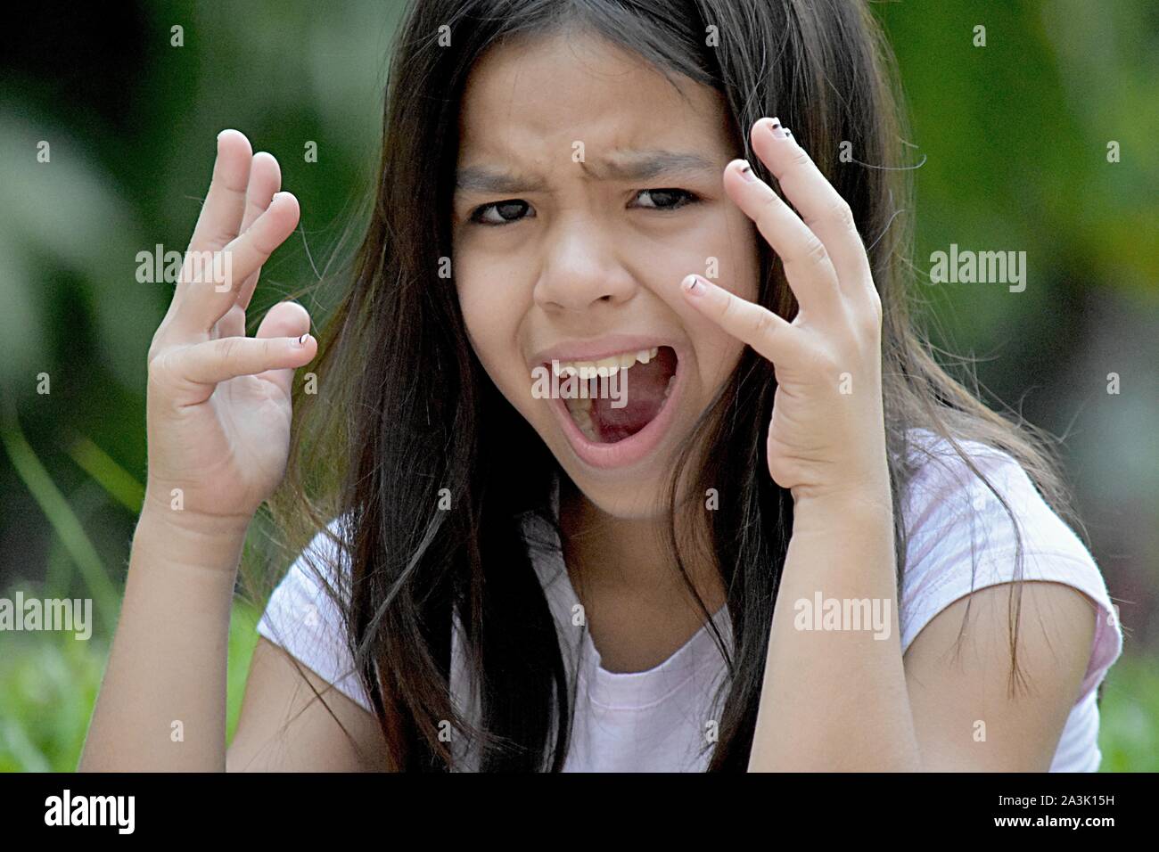 A Stressed Cute Filipina Girl Stock Photo - Alamy