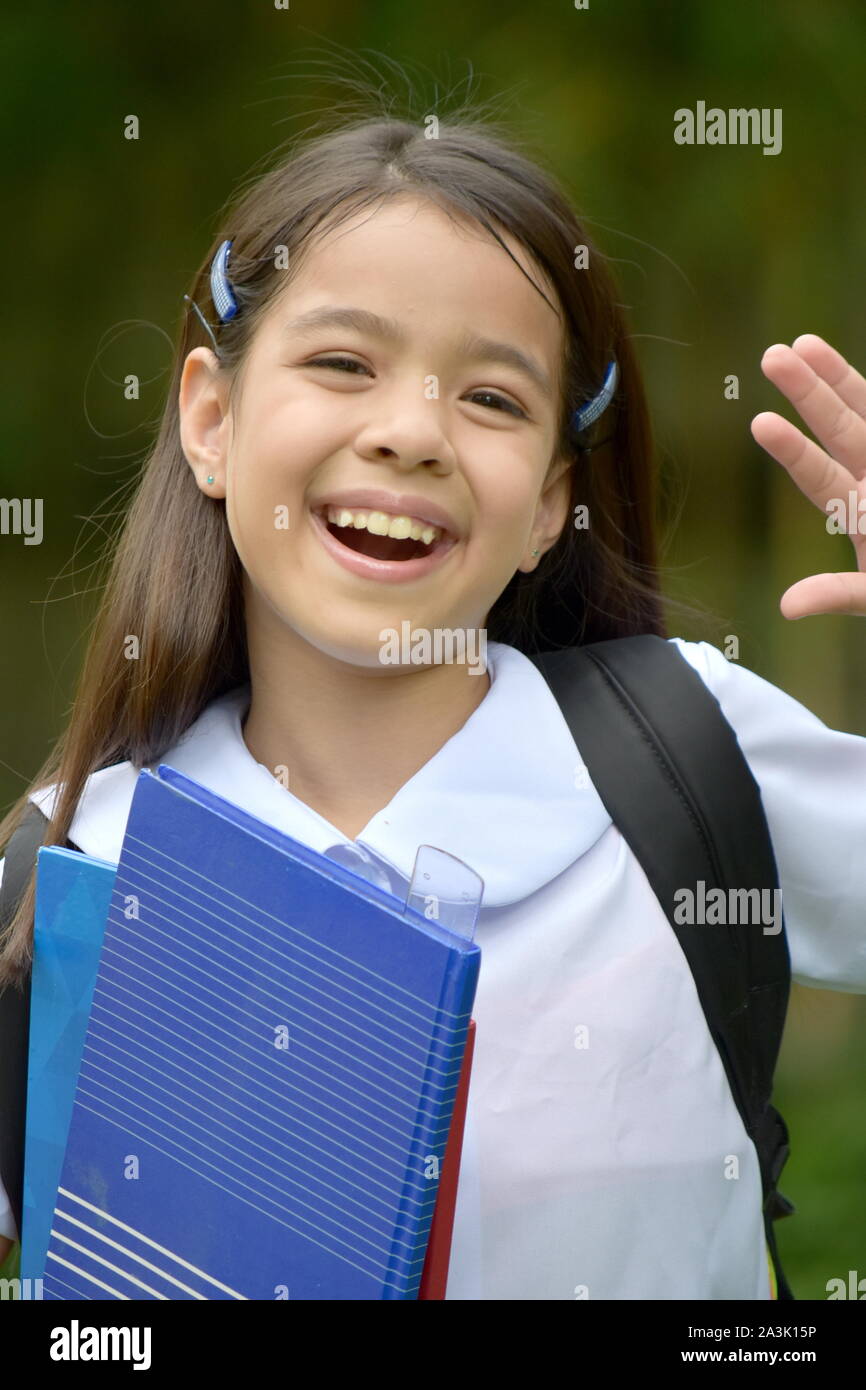 A Happy Student Child With Notebooks Stock Photo - Alamy
