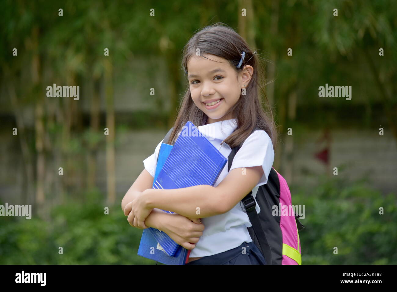 Cute Female Student Smiling Wearing Uniform Stock Photo - Alamy