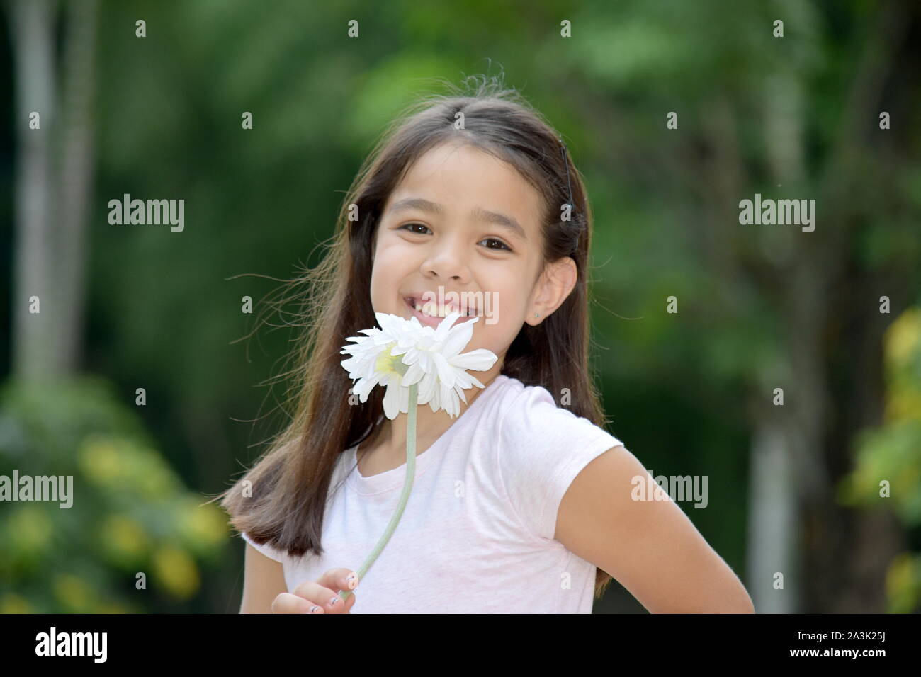 Happy Cute Person With A Daisy Stock Photo - Alamy