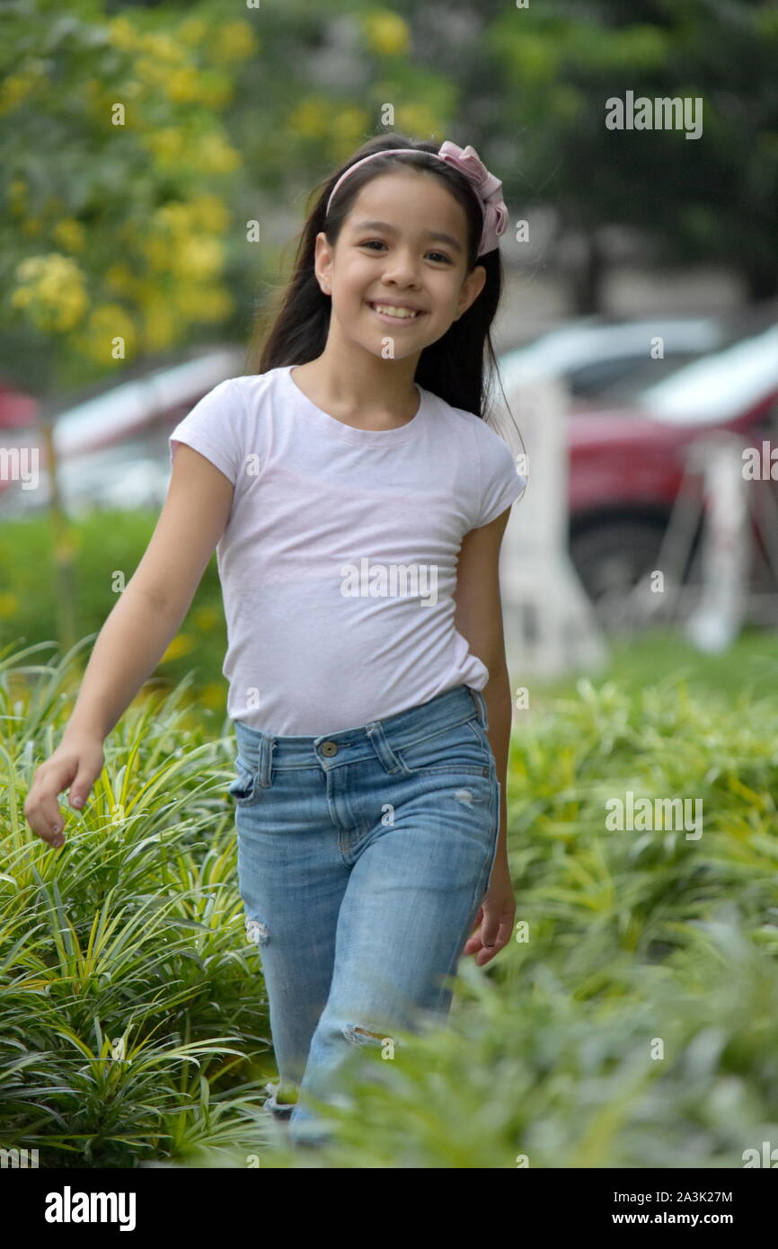 A Happy Female Tween Walking Stock Photo - Alamy
