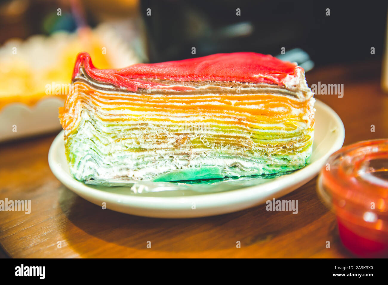 Layer cheesecake colourful rainbow sweet dessert with dipping coating ...