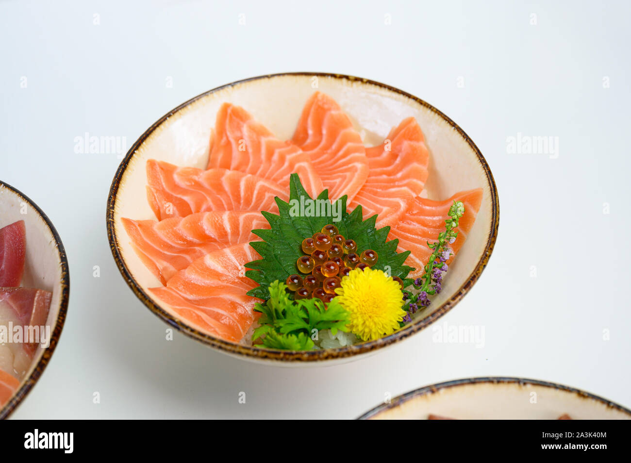 Donburi sliced raw salmon set on japanese rice in bowl Stock Photo - Alamy