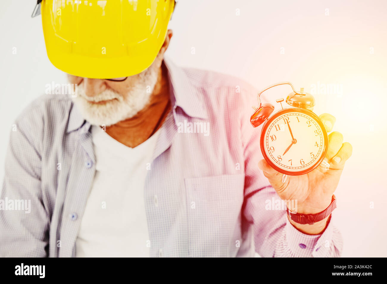 professional elder engineer working with times clock for duty Stock ...