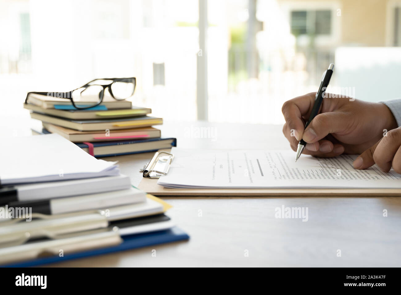 business man Office employee working contract with documents Stacks of ...