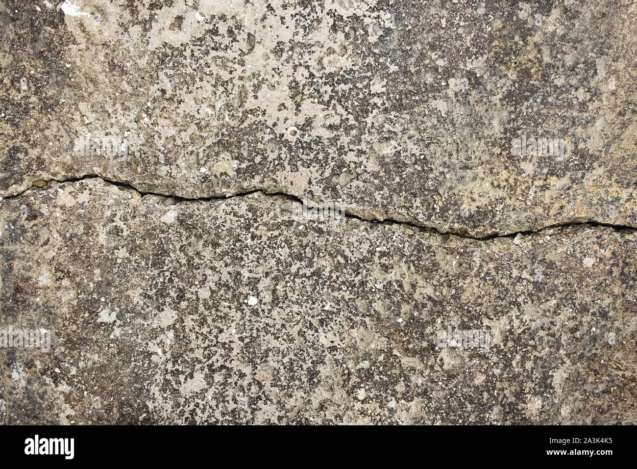 Natural background with a crack in the stone Stock Photo - Alamy