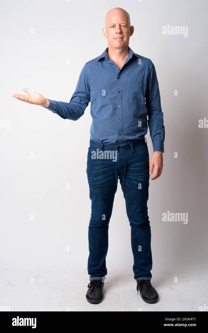 Happy mature bald businessman showing hi-res stock photography and ...