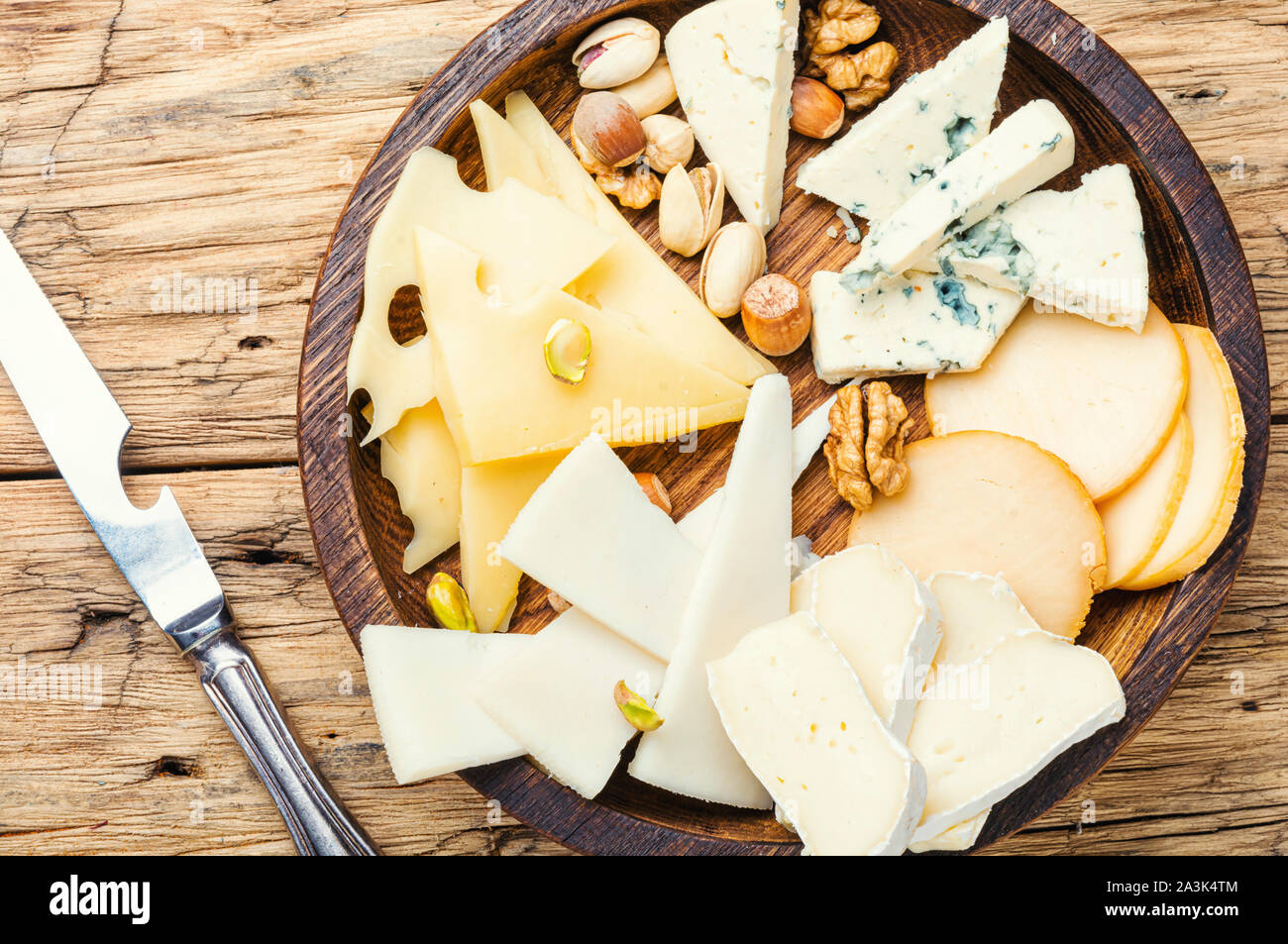 Delicious cheese on the table.Different kinds of cheeses Stock Photo ...
