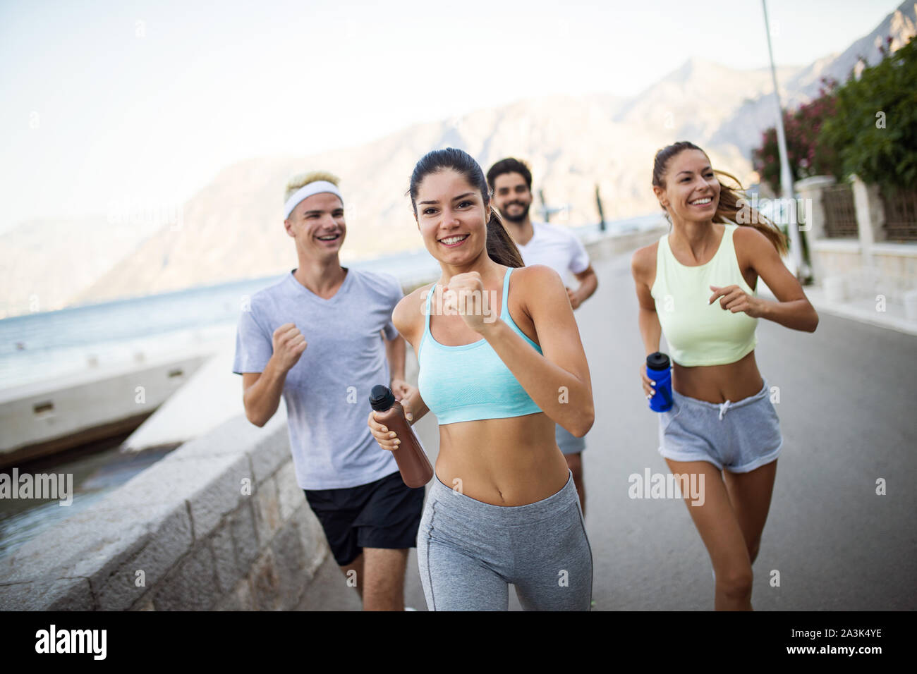 Group of young people jogging and running outdoors in nature Stock ...