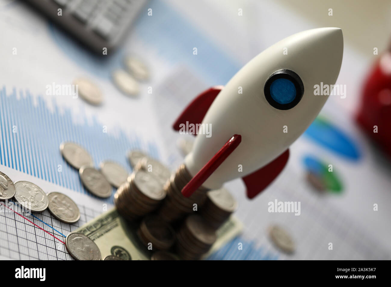 White rocket on coins Stock Photo - Alamy
