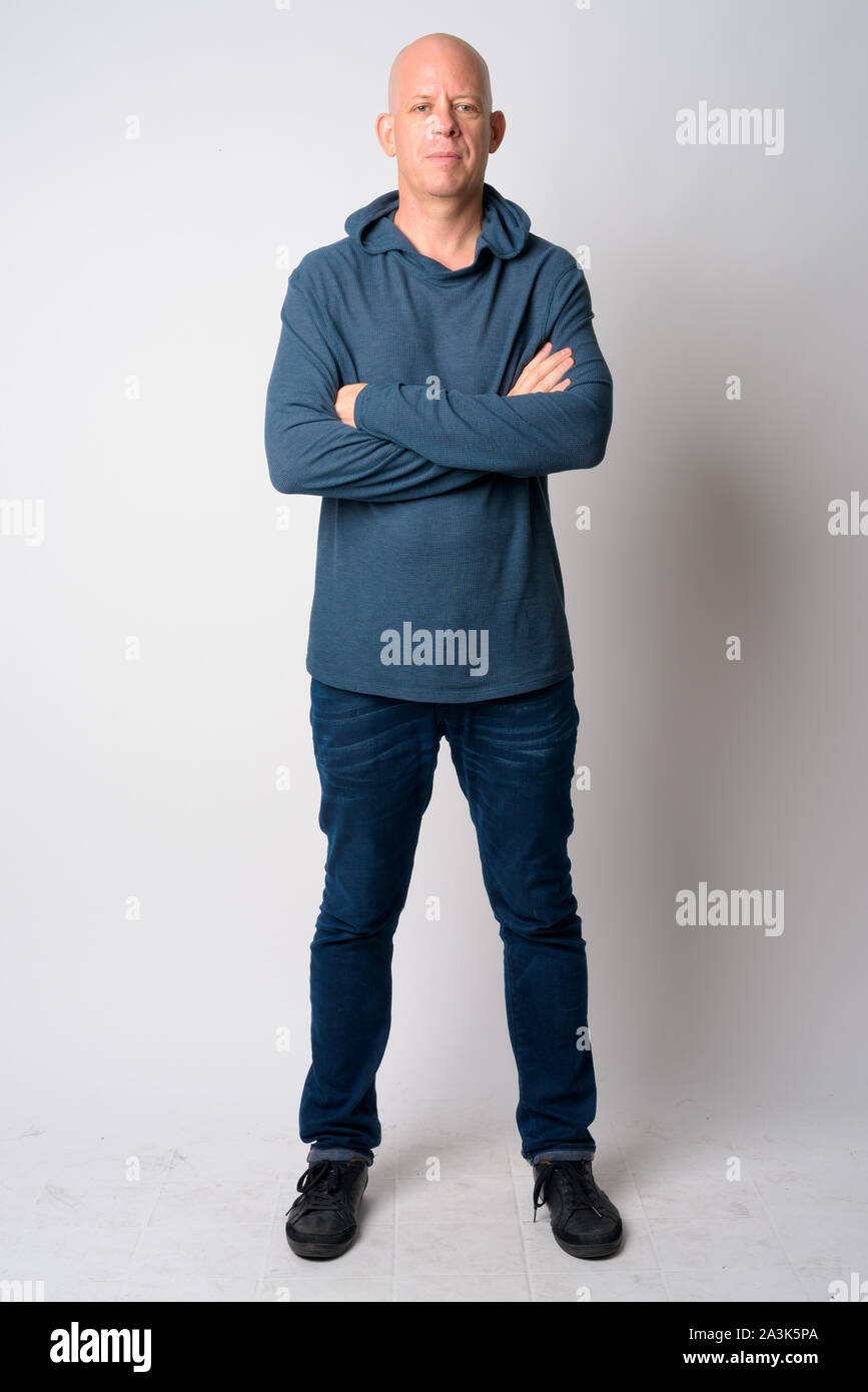 Full body shot of mature handsome bald man with arms crossed Stock ...