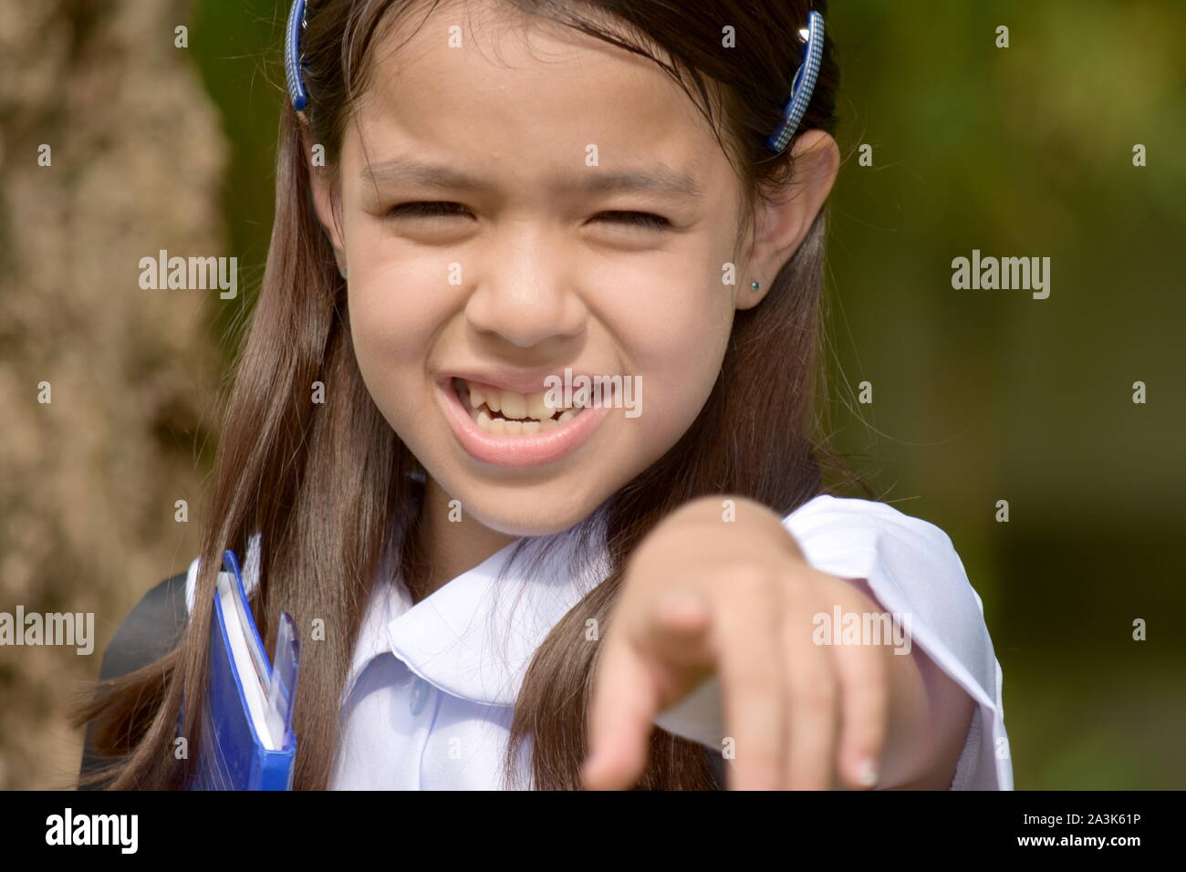 A Girl Student Pointing With Notebooks Stock Photo - Alamy