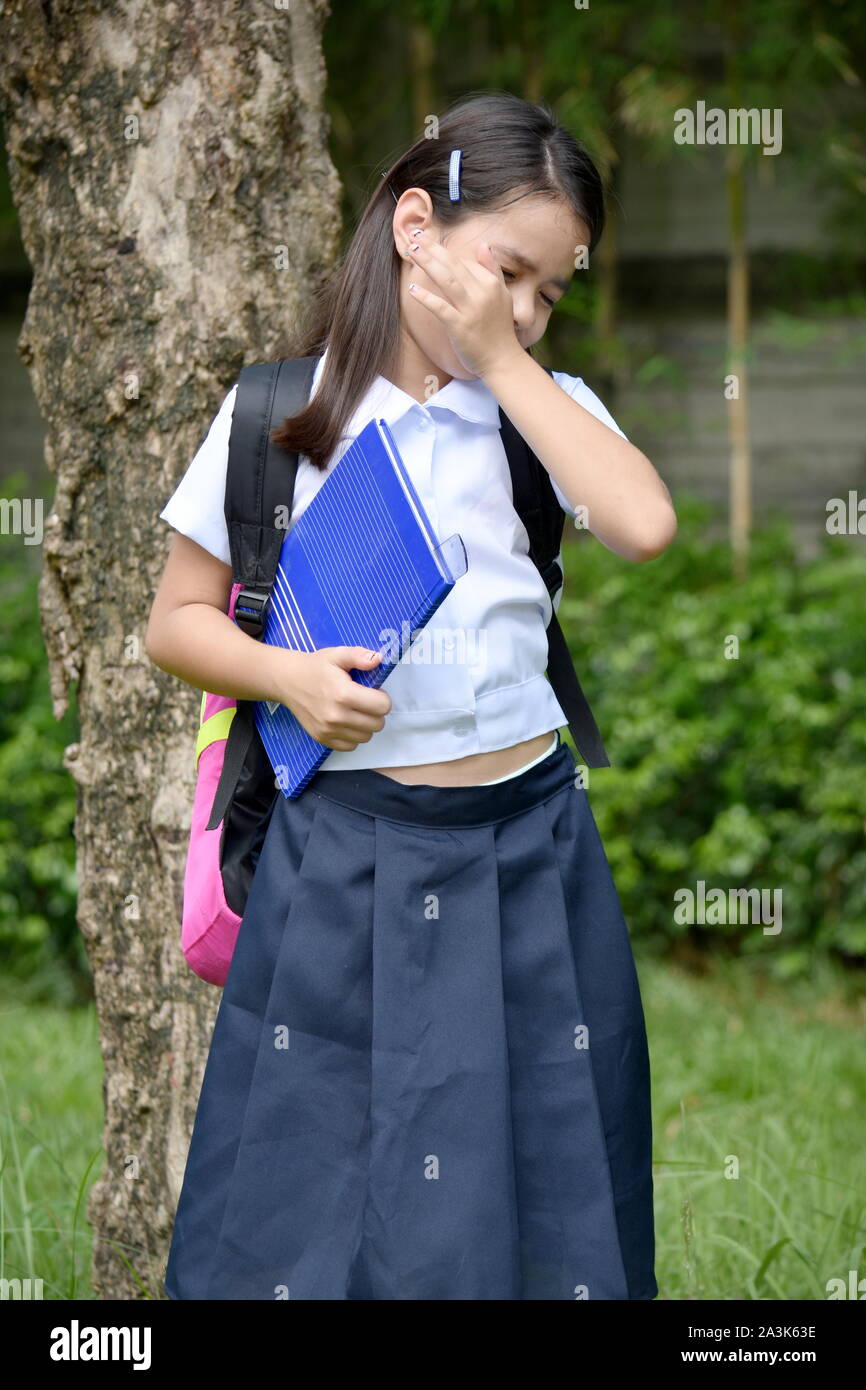 Tearful Asian Girl Student Wearing School Uniform With Notebooks Stock ...
