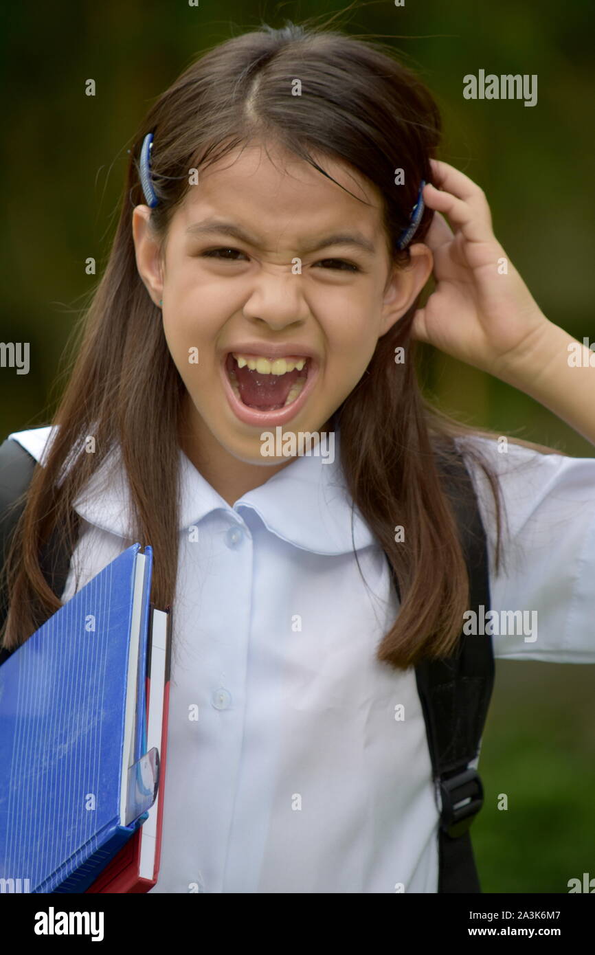 Stressed Young Filipina Female Student With Notebooks Stock Photo - Alamy
