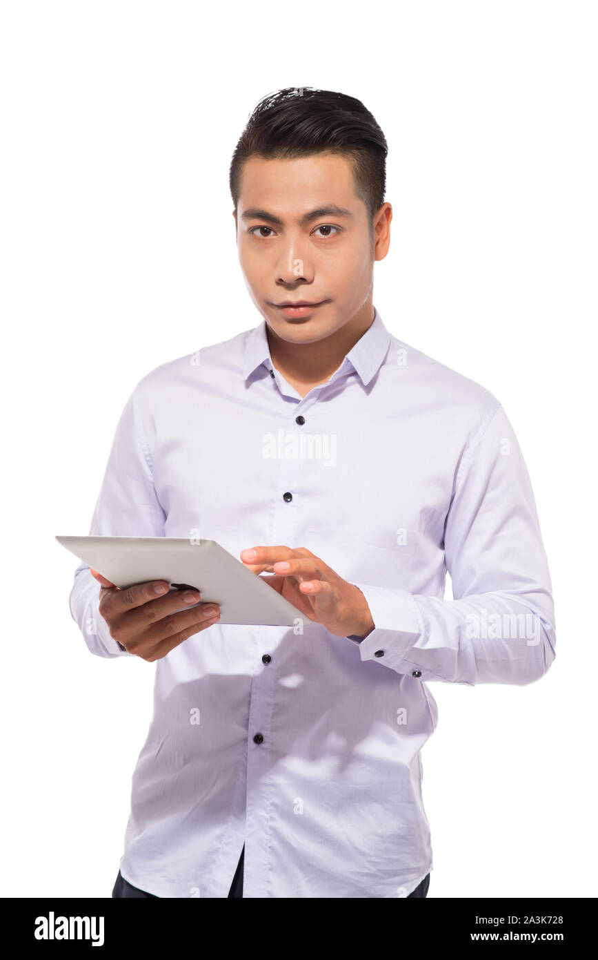 Casual man using tablet computer isolated on white background Stock ...