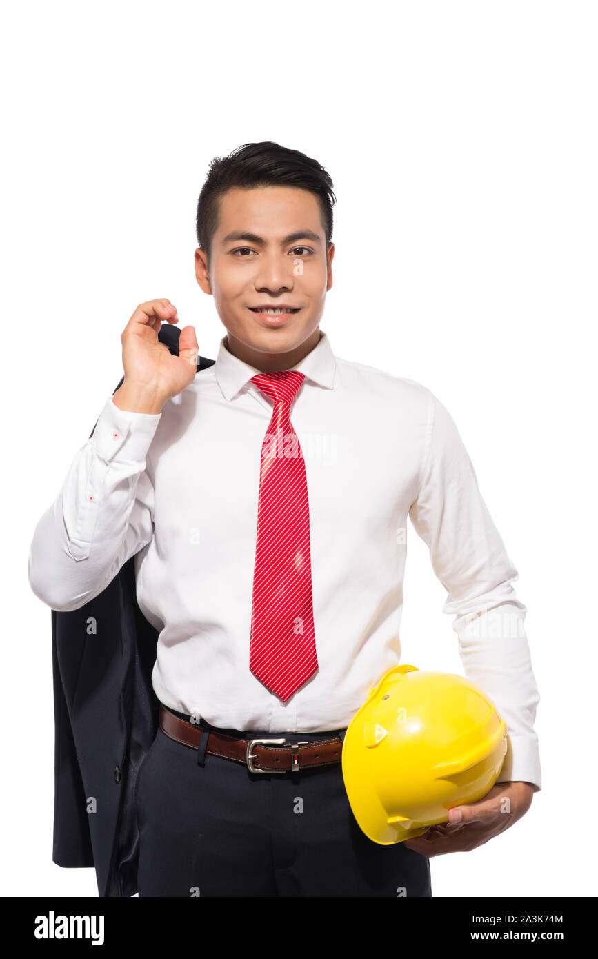 Young engineer with yellow helmet is isolated on white background Stock ...