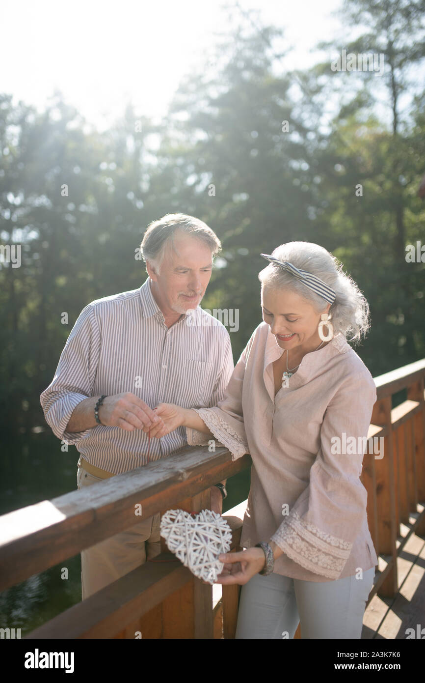 Husband and wife leaving sign of their love on the bridge Stock Photo ...