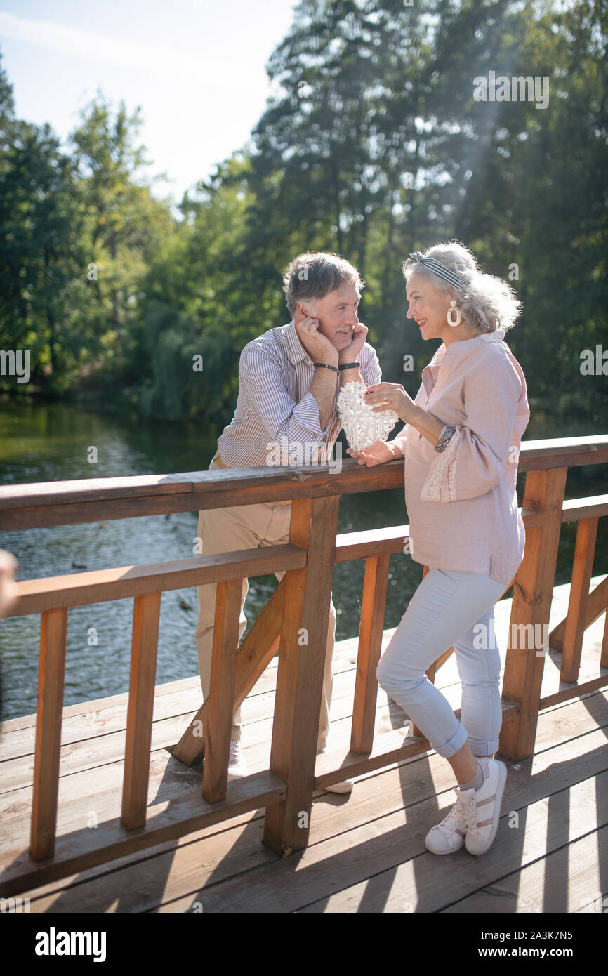 Talk woman man earrings hi-res stock photography and images - Alamy
