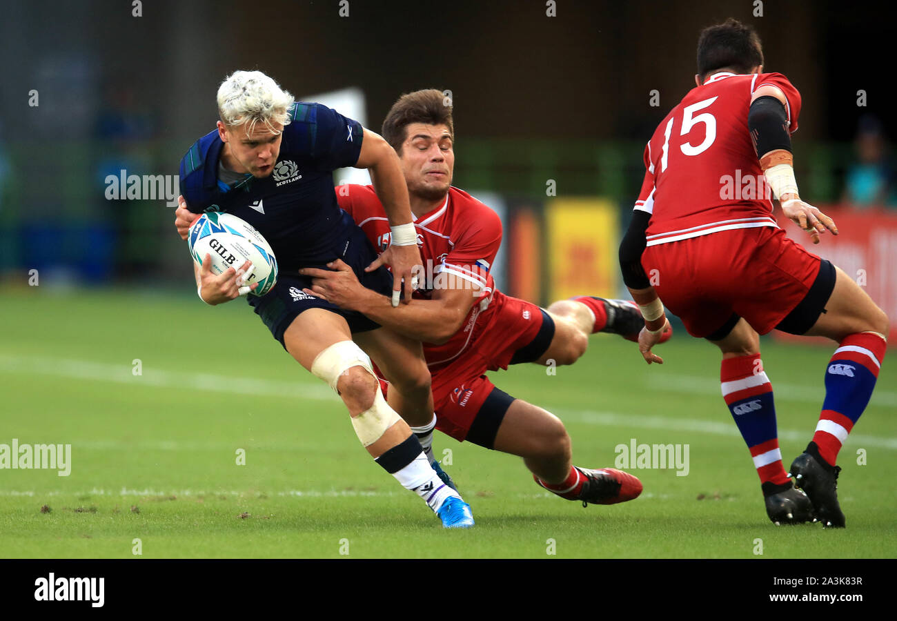 Scotland's Darcy Graham (left) is tackled by Russia's German Davydov ...