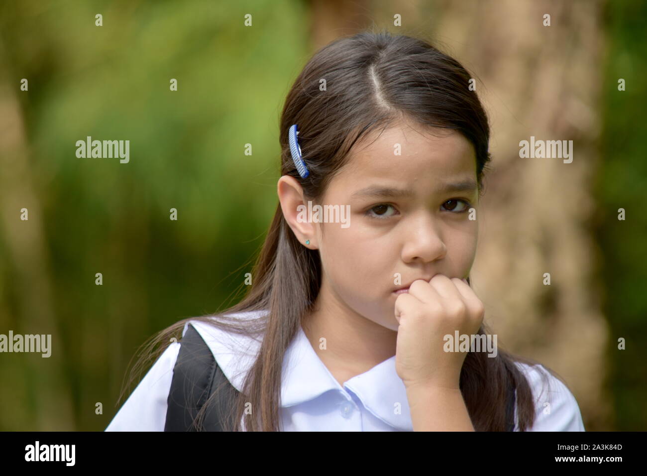 Fearful Asian Girl Student With Books Stock Photo - Alamy