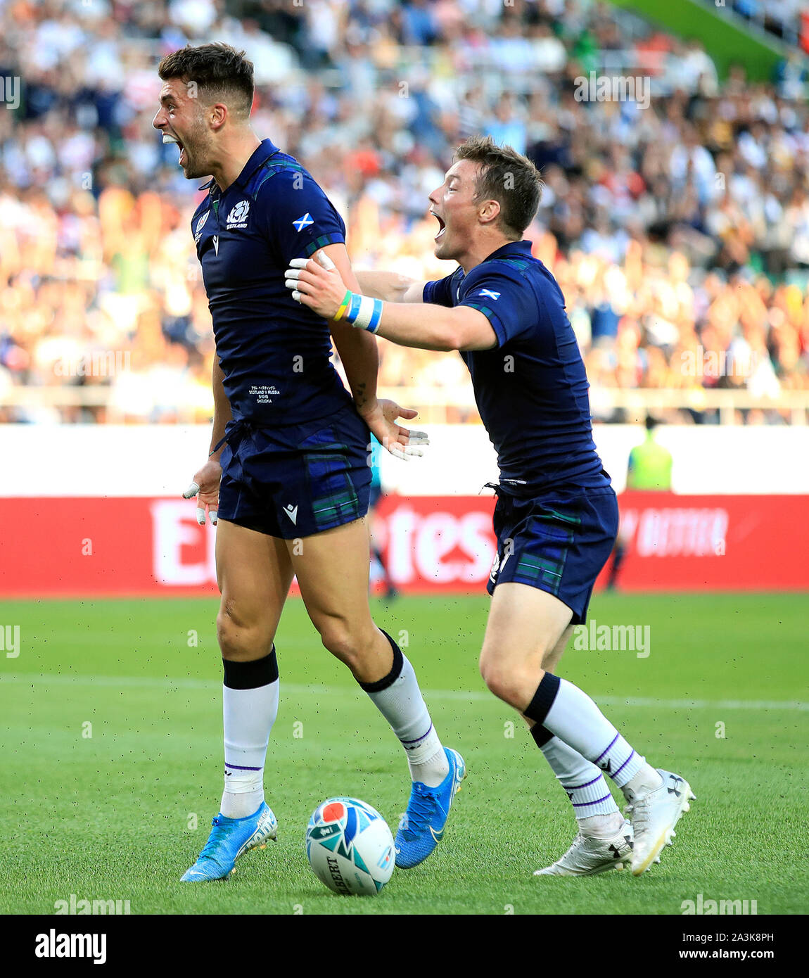 Scotland's Adam Hastings (left) celebrates scoring his second try of ...